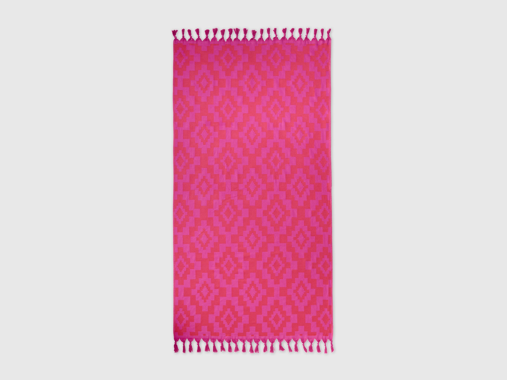 Fuchsia beach towel with ethnic pattern